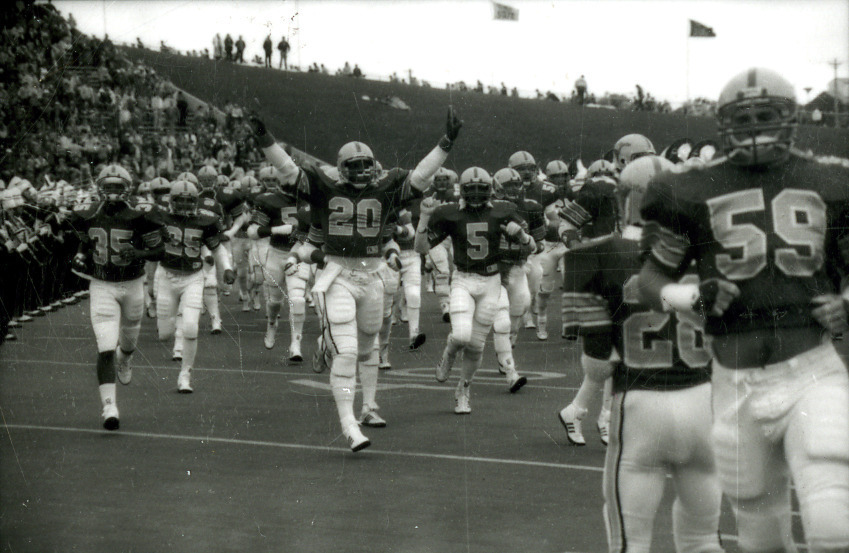 ISU football team entering the field for the Homecoming game, 1985 ...